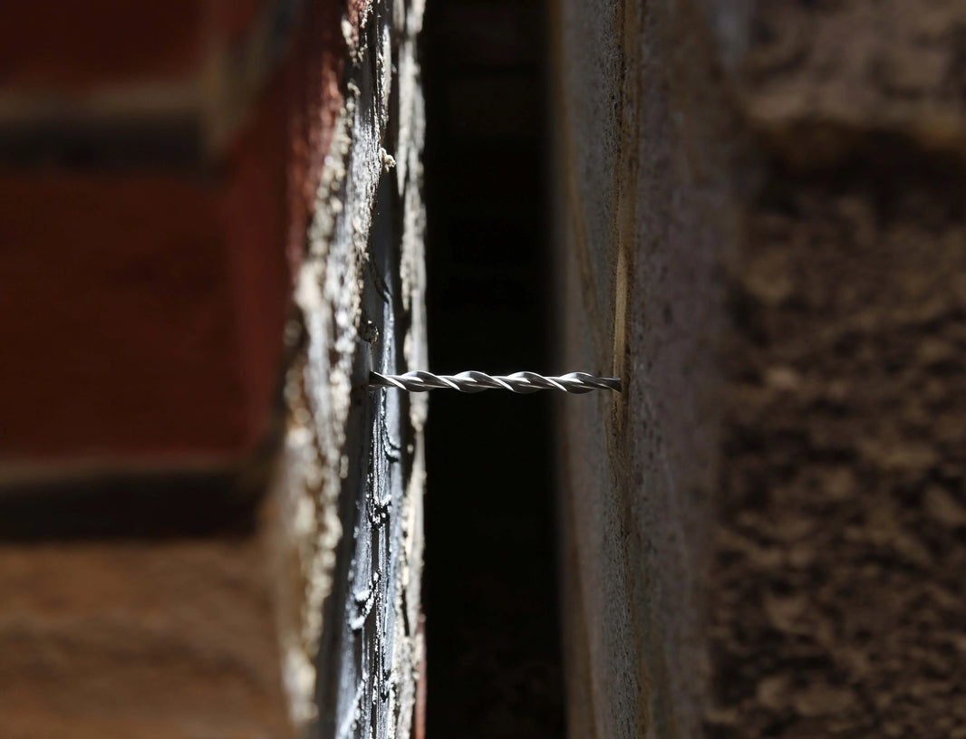 Repair of failed expanded metal lath (EML) lintels using helical bar ...